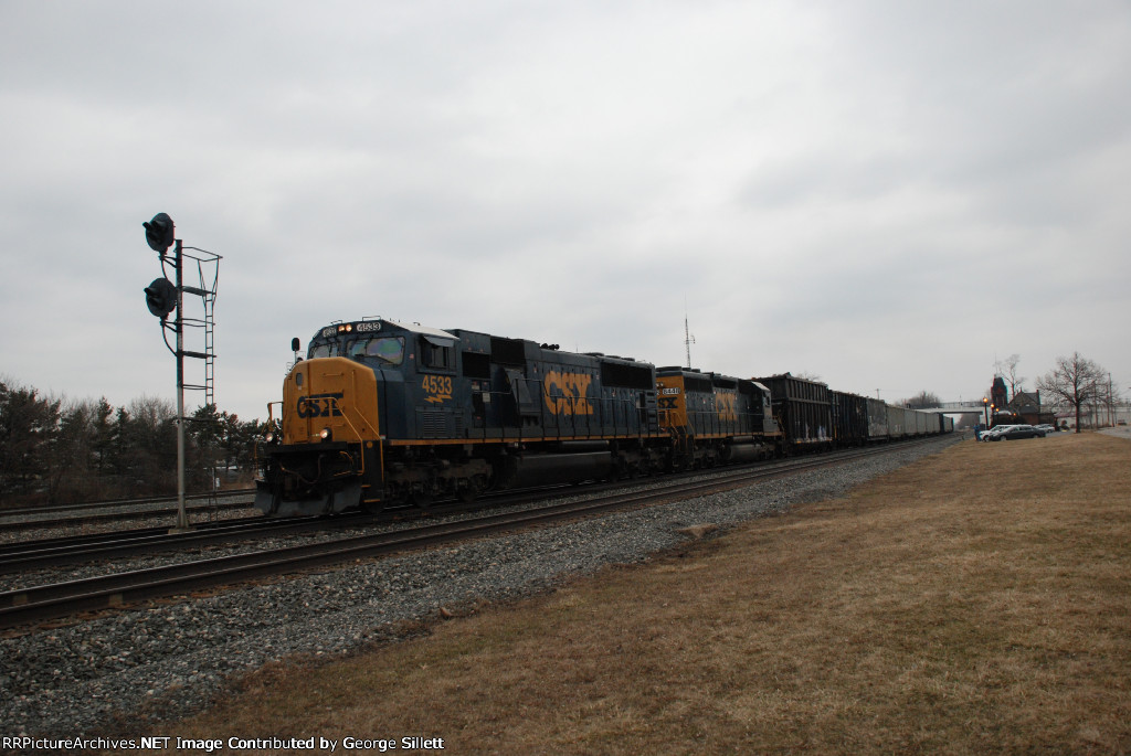 CSX 4533, and an SD40-2 take a trash train west.